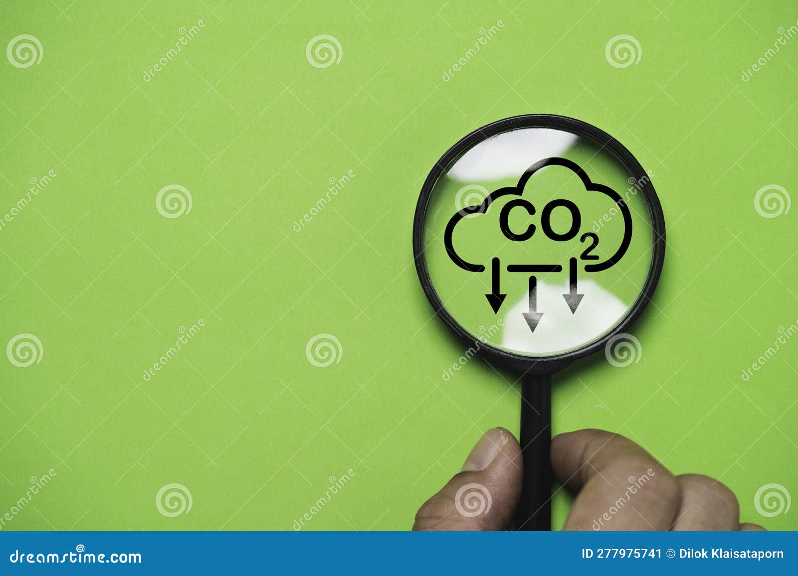 Hand Holding CO2 Reducing Icon Inside Magnifier Glass for Focusing ...