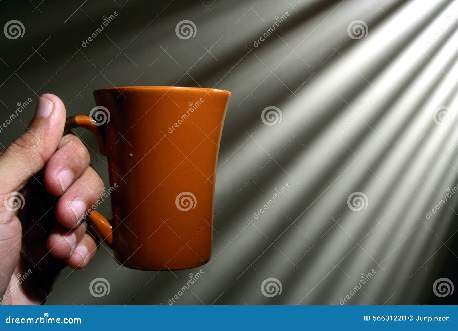 Hand holding a coffee mug stock photo. Image of knuckles - 56601220