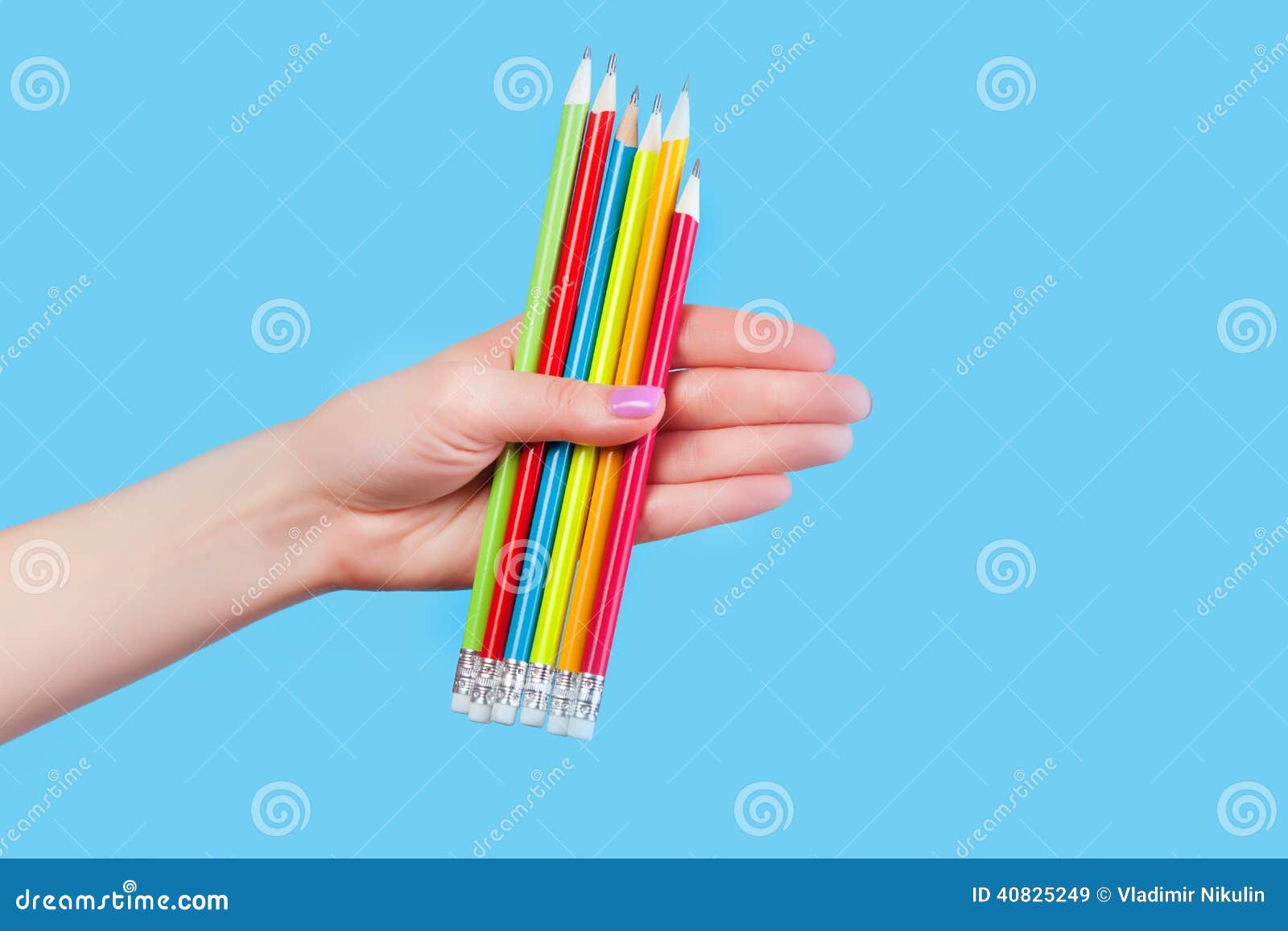Hand holding color pencils stock image. Image of pure - 40825249
