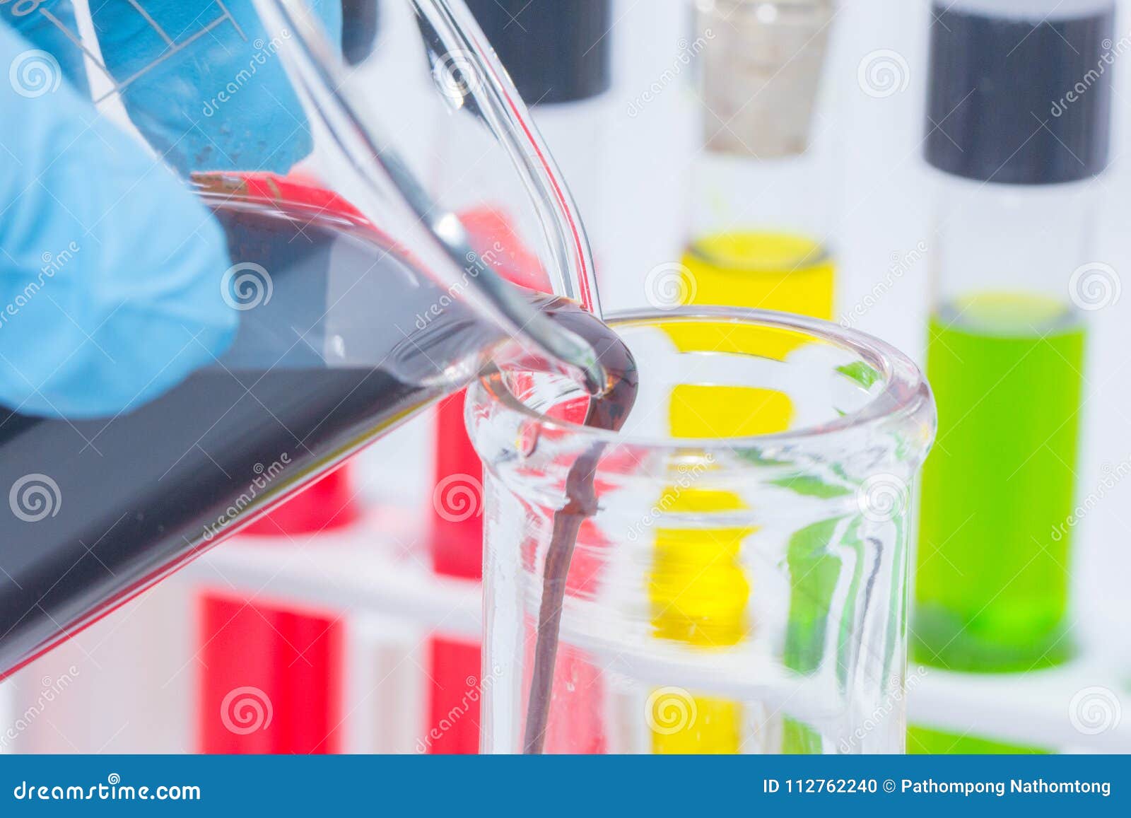Hand Holding Colorful Liquid in Beaker Stock Photo - Image of analysis ...