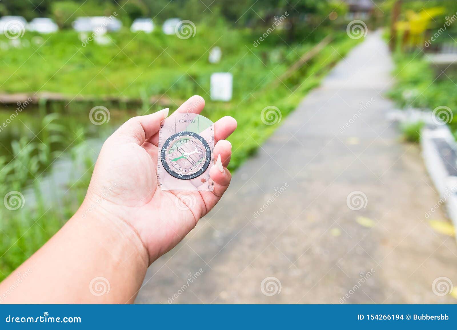 Hand holding the compass stock photo. Image of direction - 154266194