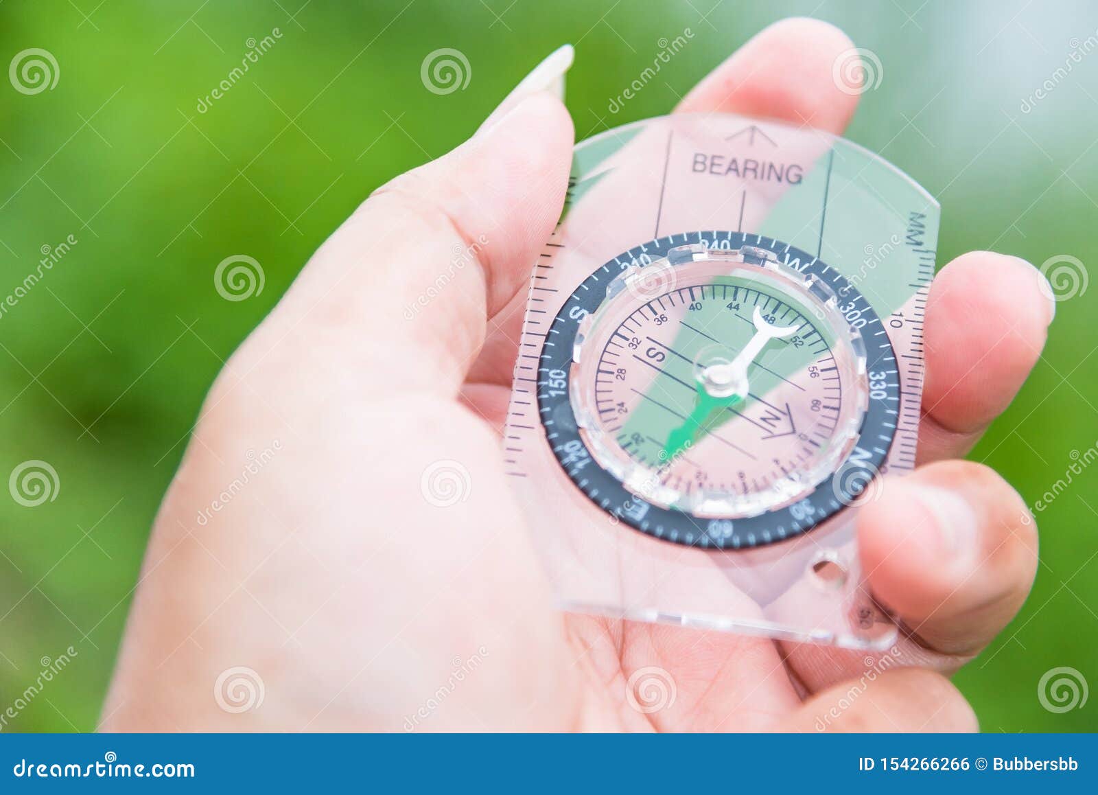 Hand holding the compass stock photo. Image of mountain - 154266266