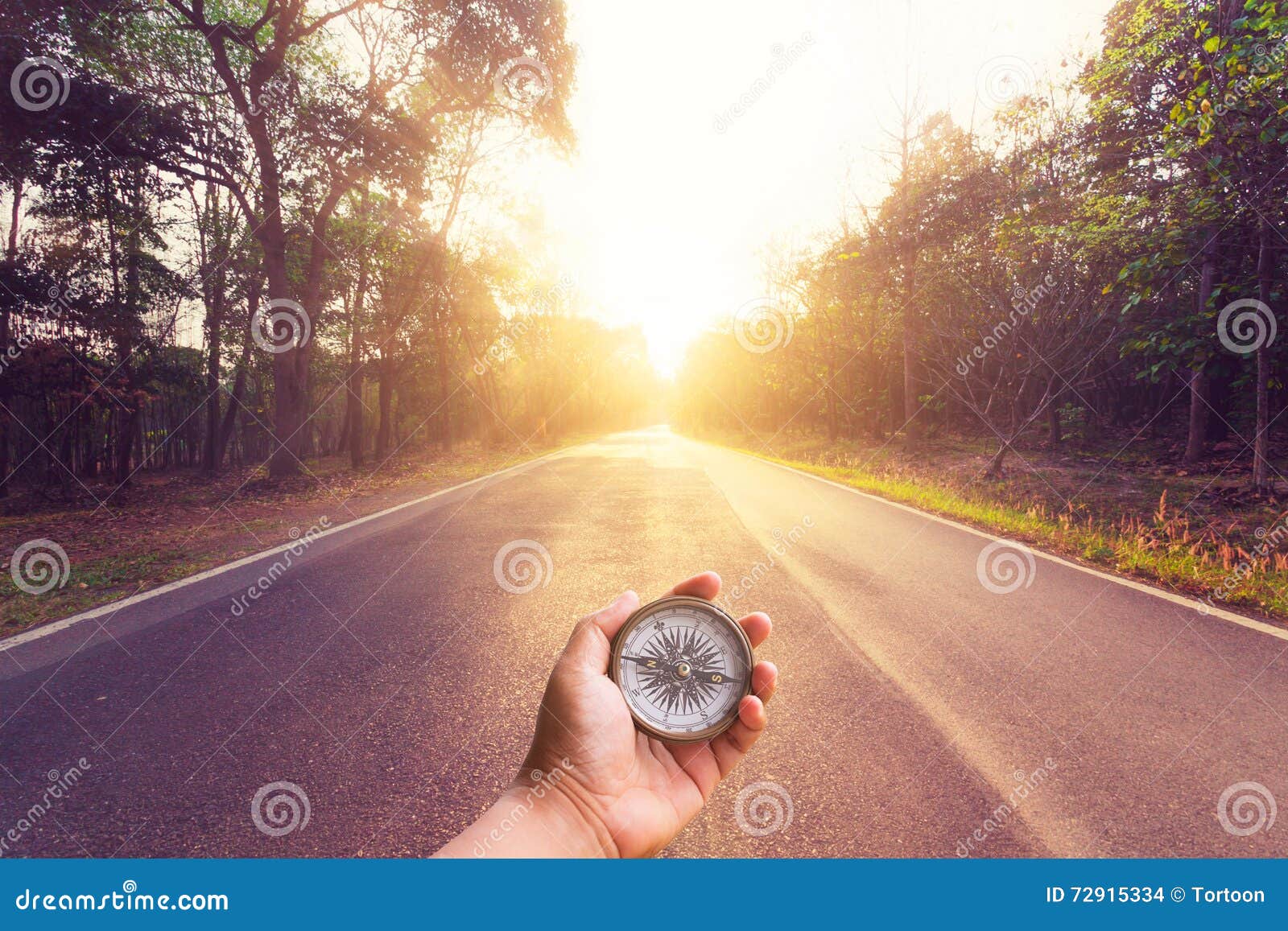 Hand Holding Compass on Empty Asphalt Road Stock Photo - Image of ...