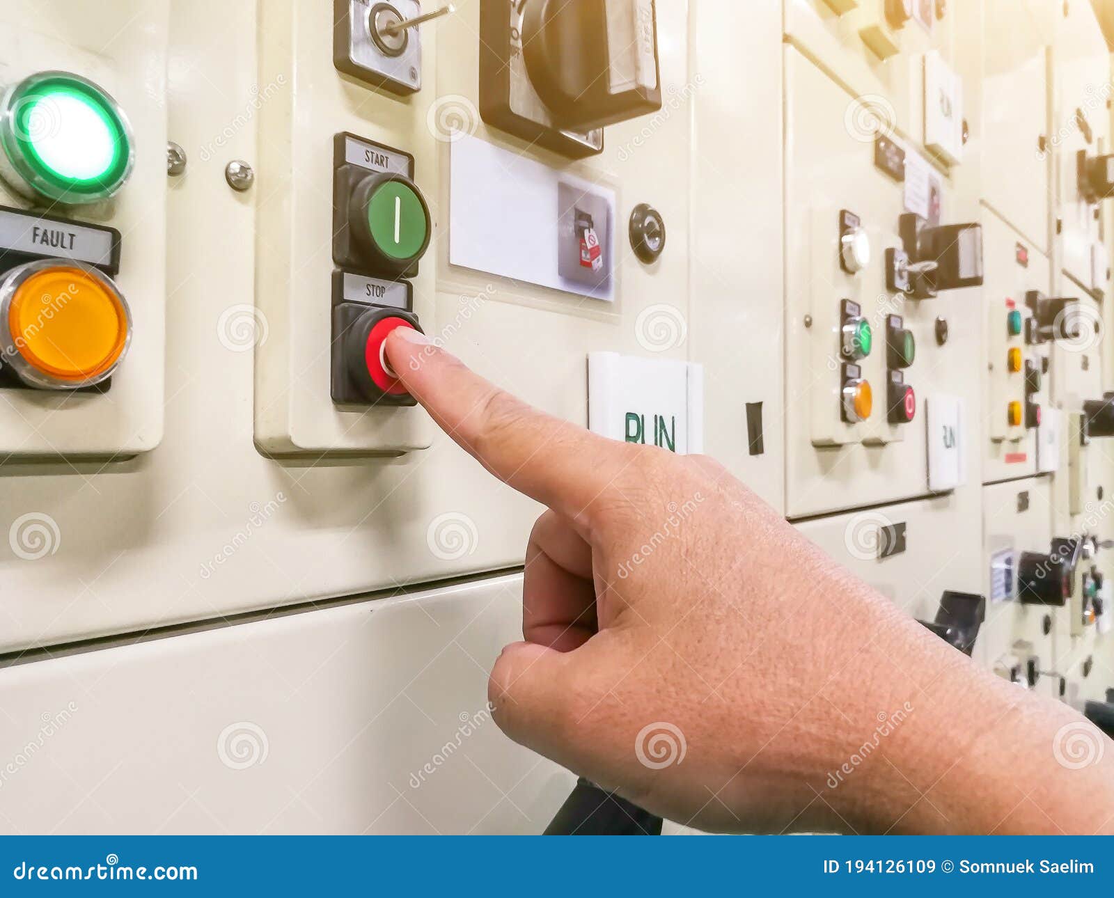Hand Holding The Control Panel Of The Industrial Plant And Pushing Or ...