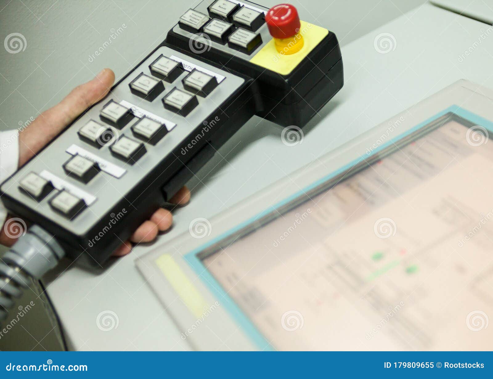 Hand Holding the Control Panel Stock Image - Image of holding, monitor ...