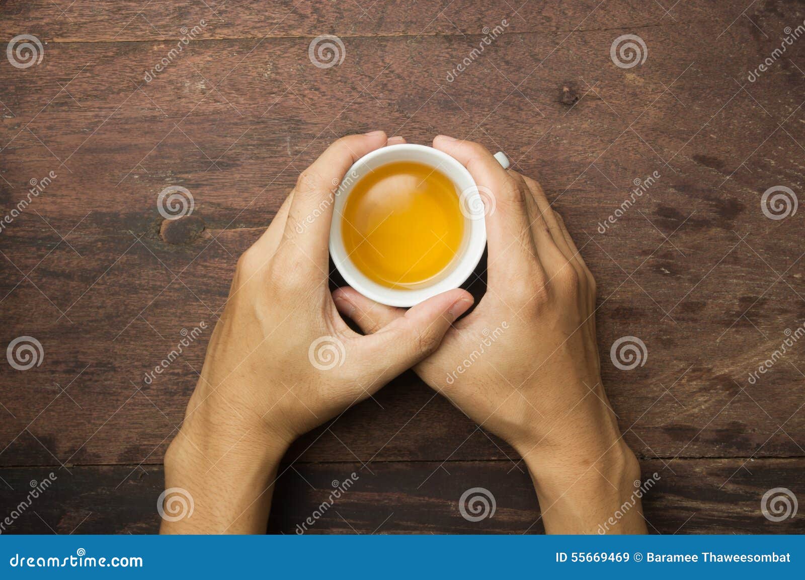 Hand holding cup of tea stock image. Image of drinking - 55669469