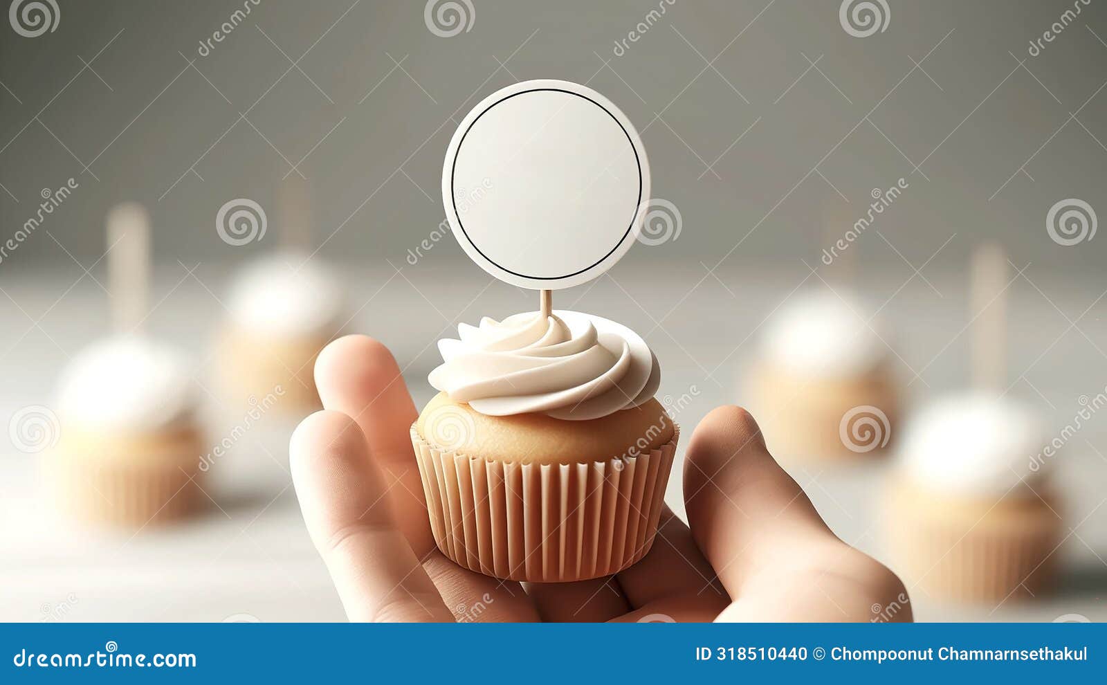 Hand Holding a Cupcake Topper Mockup with a Round Label Stock ...