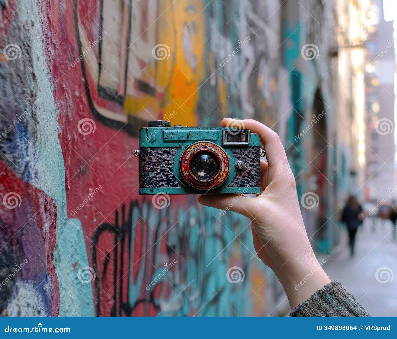 Hand Holding Custom-painted Camera with Graffiti Background Stock Photo ...