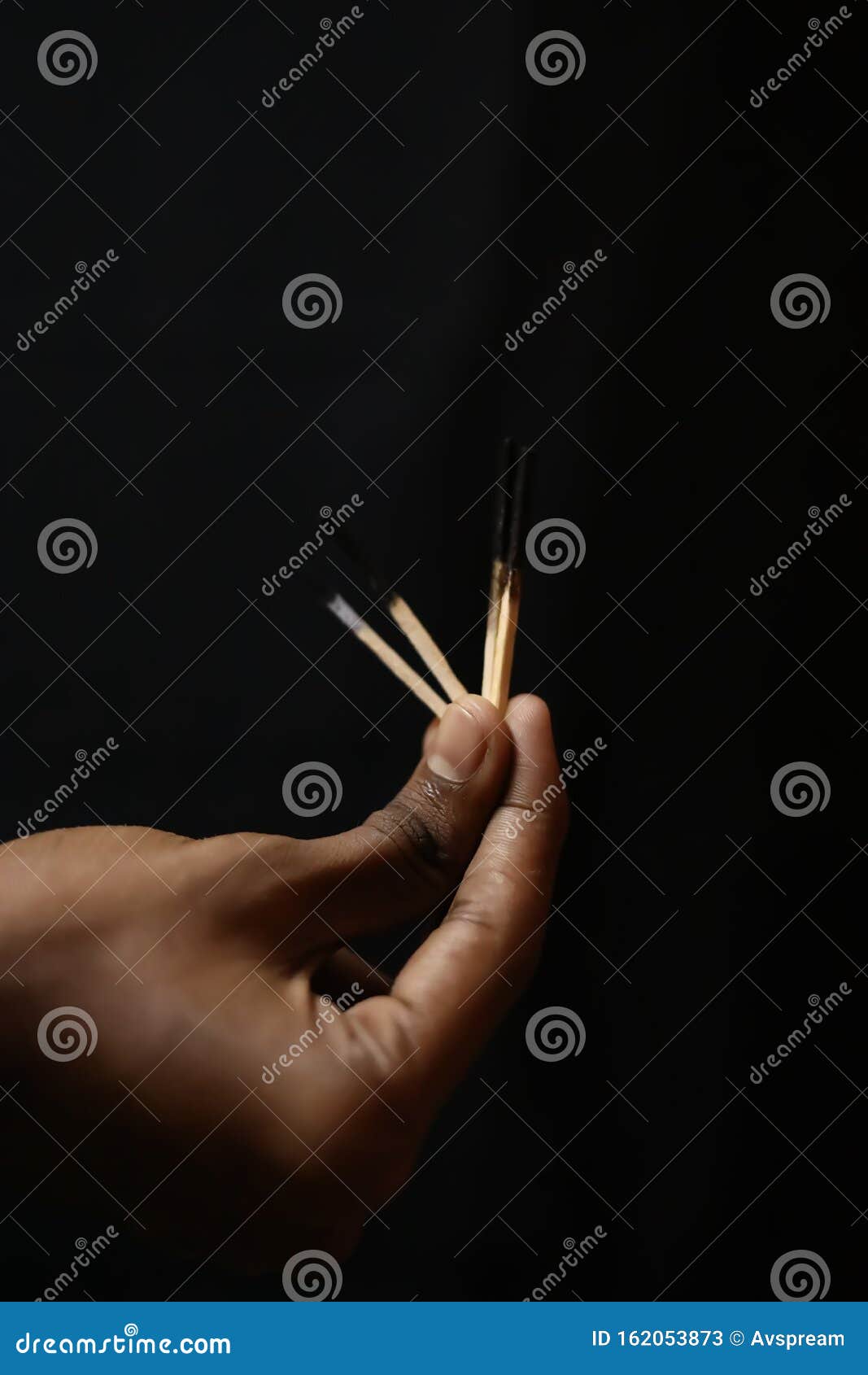 Hand Holding an Different Extinguished Matchstick on Black Background ...