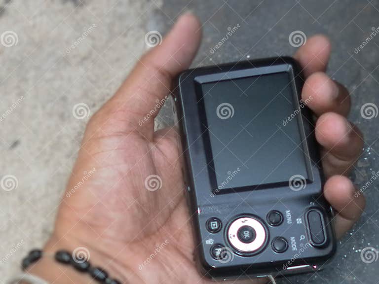 Hand Holding Digital Camera Rear View Stock Image - Image of fingers ...