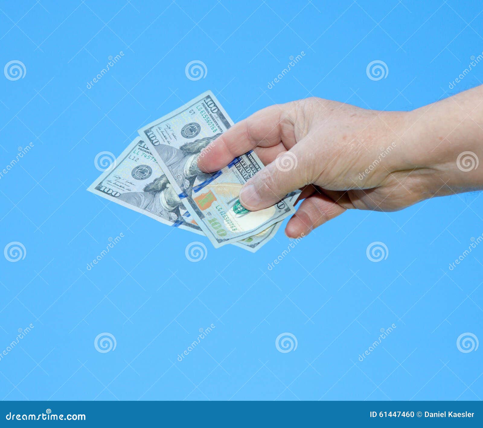 Hand holding dollar notes stock photo. Image of money - 61447460