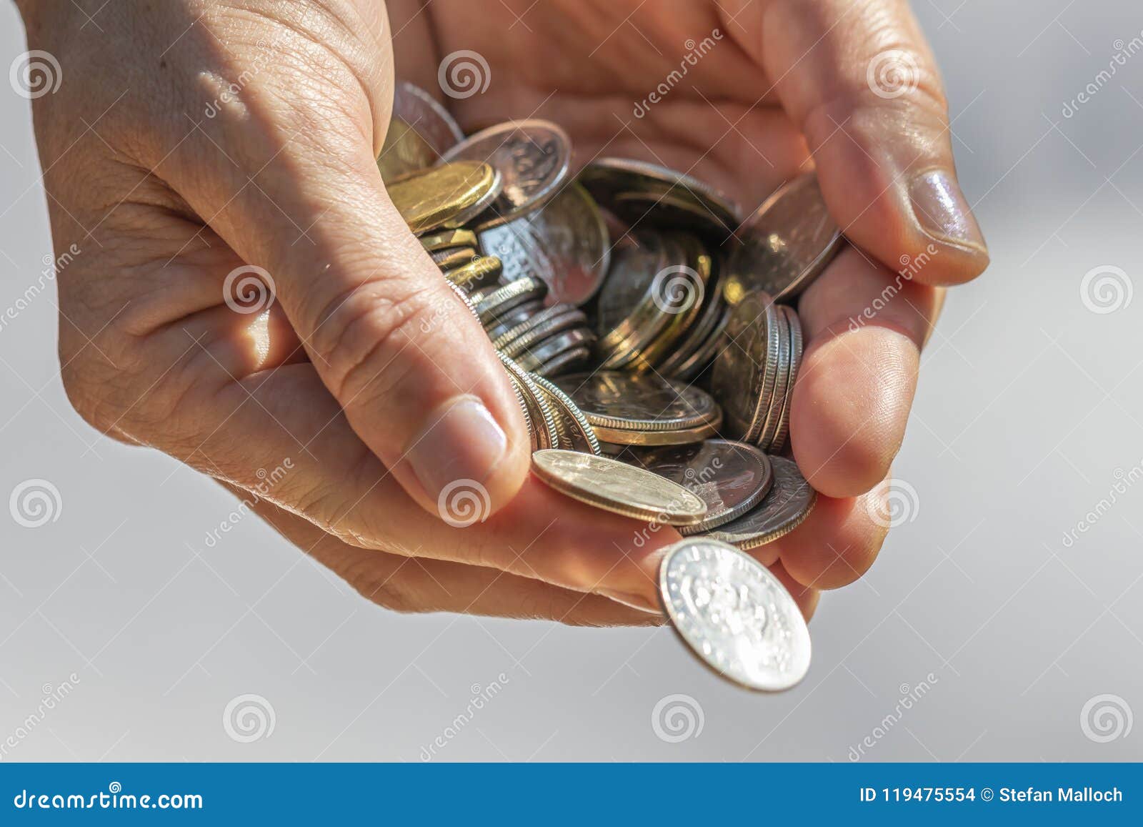 A Hand Holding and Dropping Coins Editorial Stock Image - Image of ...