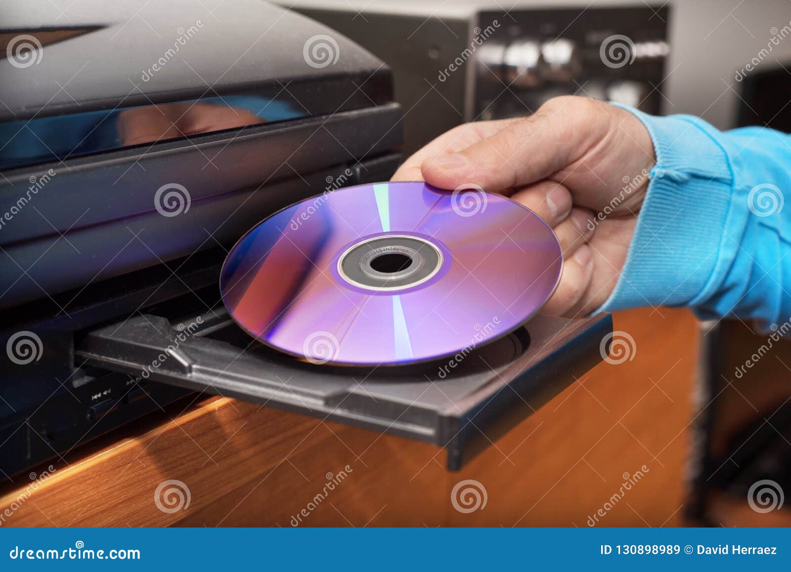 Hand Holding DVD Inserting To Video Player Stock Image - Image of ...