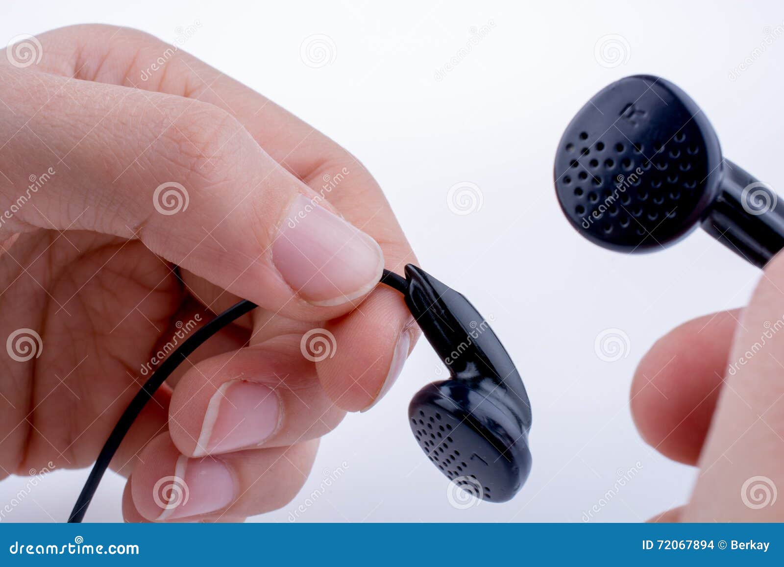 Hand holding earphone stock photo. Image of device, holding - 72067894