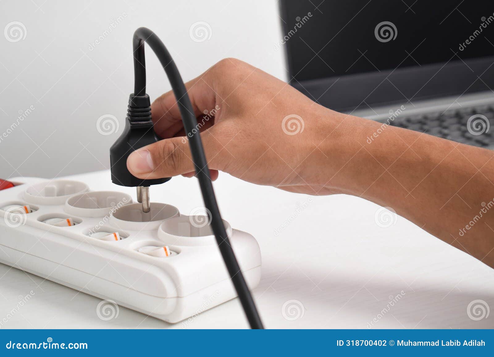 Hand Holding Electric Plug, Multiple Socket with Connected Plugs ...