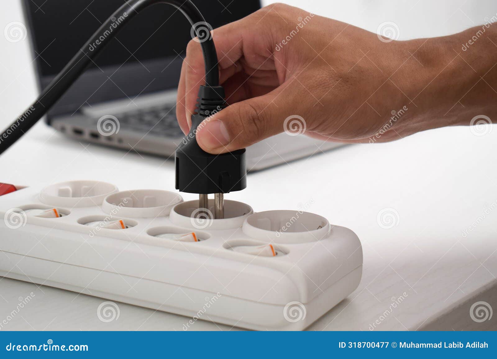 Hand Holding Electric Plug, Multiple Socket with Connected Plugs Stock ...