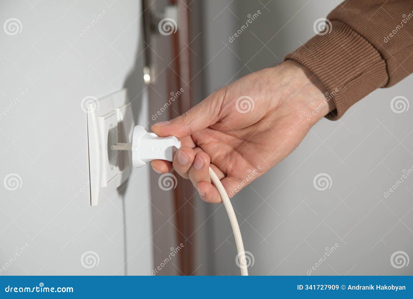 Hand Holding Electric Plug into a Power Outlet Stock Illustration ...