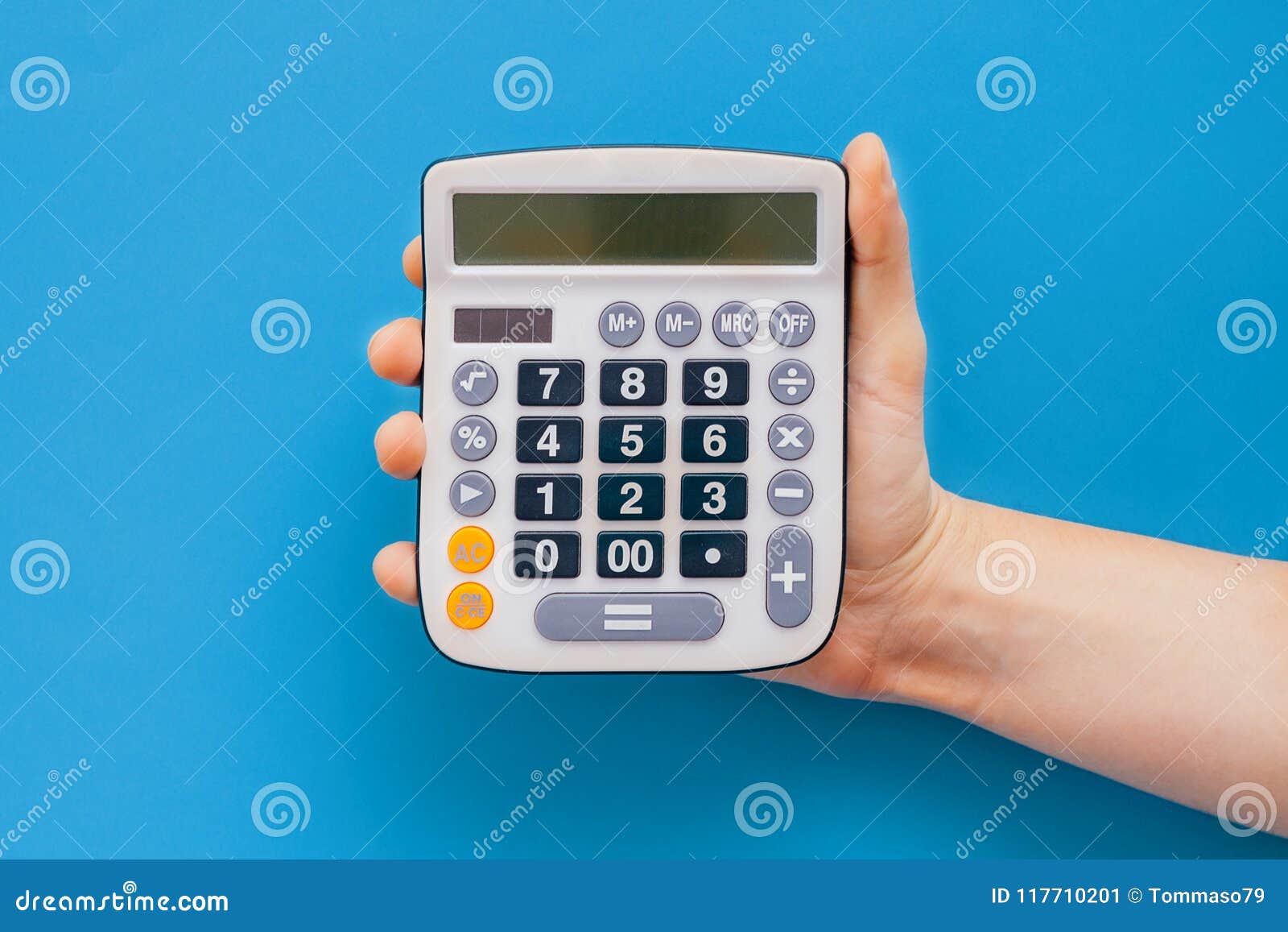 Hand Holding Electronic Calculator Ob Blue Background Stock Image ...