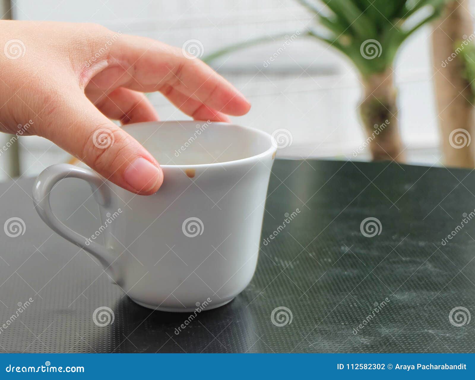 Hand Holding Empty Cup of Coffee on the Table Stock Photo - Image of ...