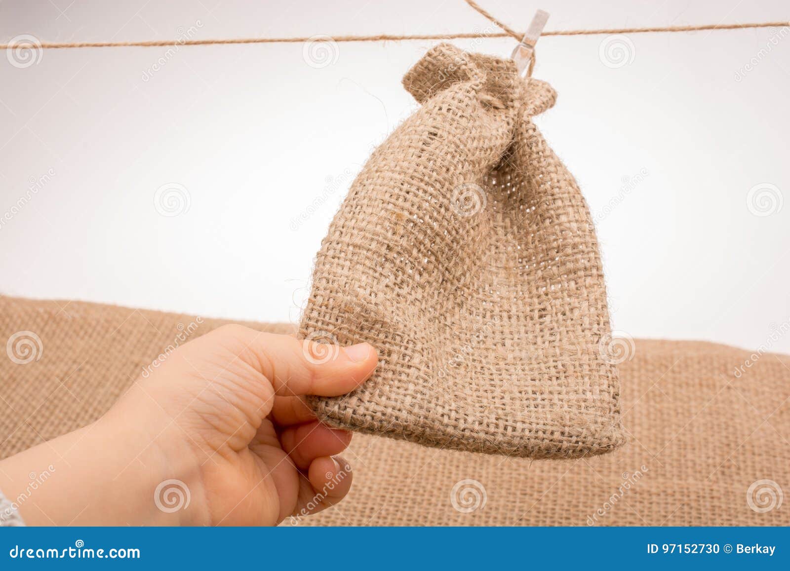 Hand Holding Empty Little Sack Made of Linen Stock Photo - Image of ...