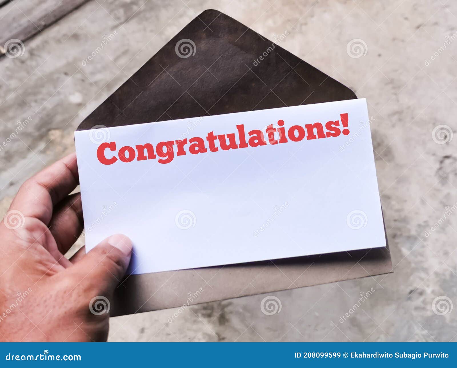 Hand Holding Envelope with White Card Written Text CONGRATULATIONS ...