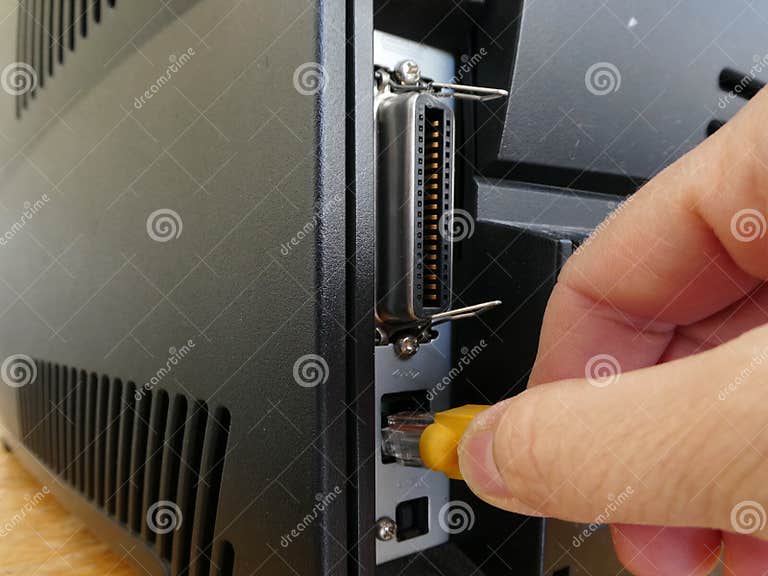 Hand Holding Ethernet Connecior To Connecting a Printer To the Net ... Hand Holding Ethernet Connecior To Connecting a Printer To the Net ...