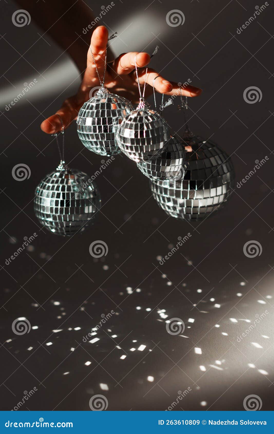 The Hand is Holding Few Little Disco Balls Stock Image - Image of light ...