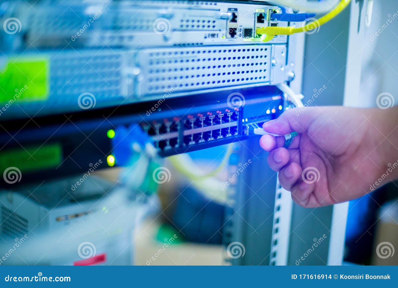 Hand Holding Fiber Optic Cord with Ethernet Cables and Network ...