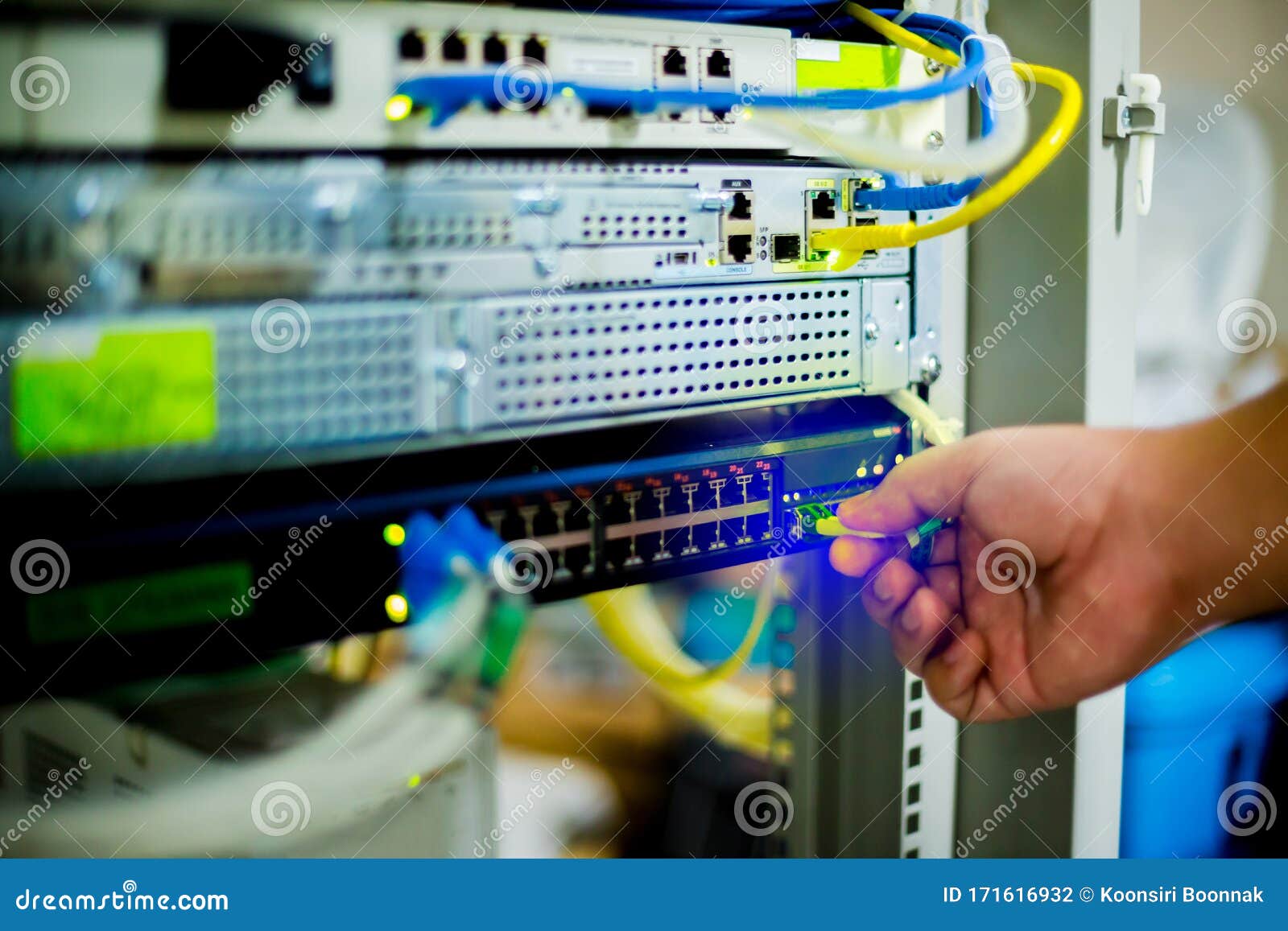 Hand Holding Fiber Optic Cord with Ethernet Cables and Network ...