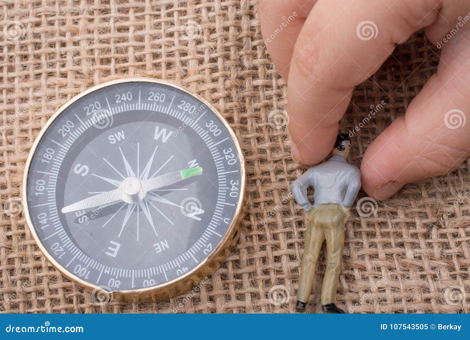 Figurine by the Side of a Compass Stock Image - Image of measurement ...