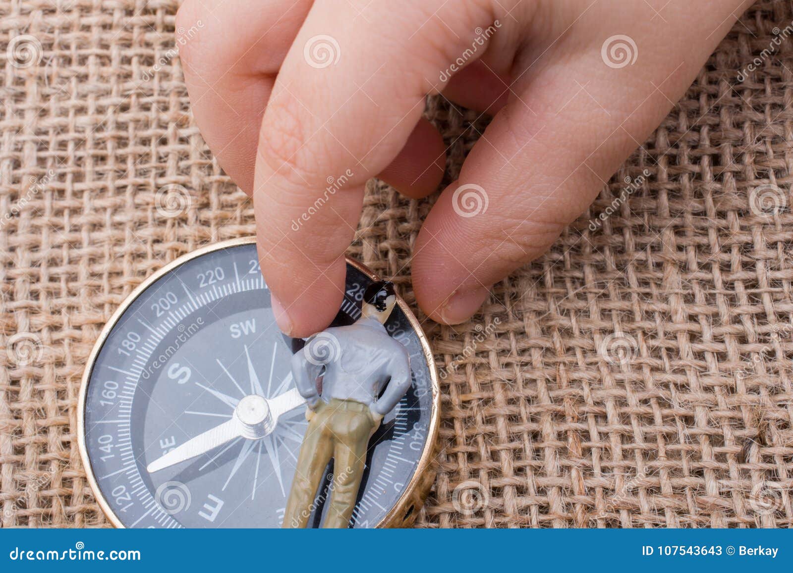 Figurine by the Side of a Compass Stock Image - Image of design ...
