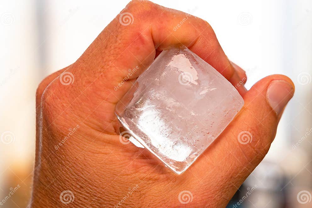 Hand Holding between the Fingers an Ice Cube, Solid Water Stock Photo ...