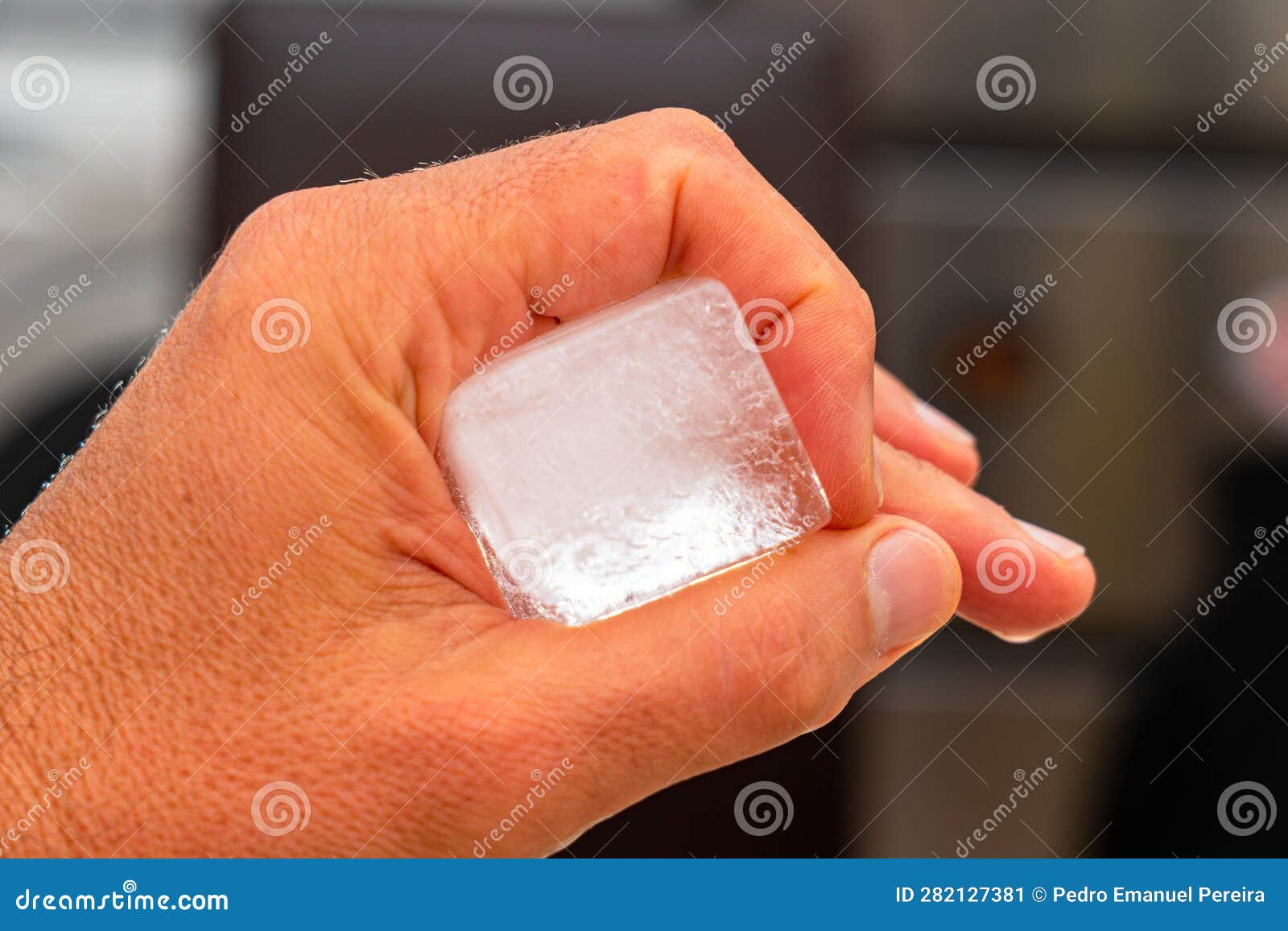 Hand Holding between the Fingers an Ice Cube, Solid Water Stock Image ...