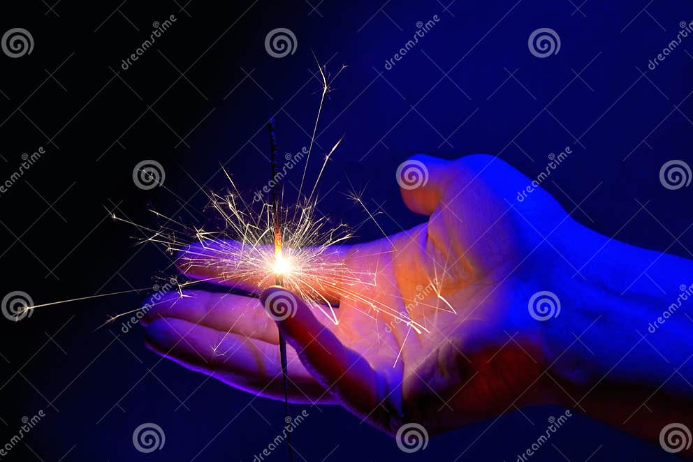 Hand Holding Fire Light Sparkler Stock Photo - Image of event ...