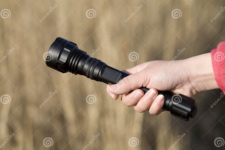 Hand holding a flashlight stock photo. Image of enforcement - 7197246