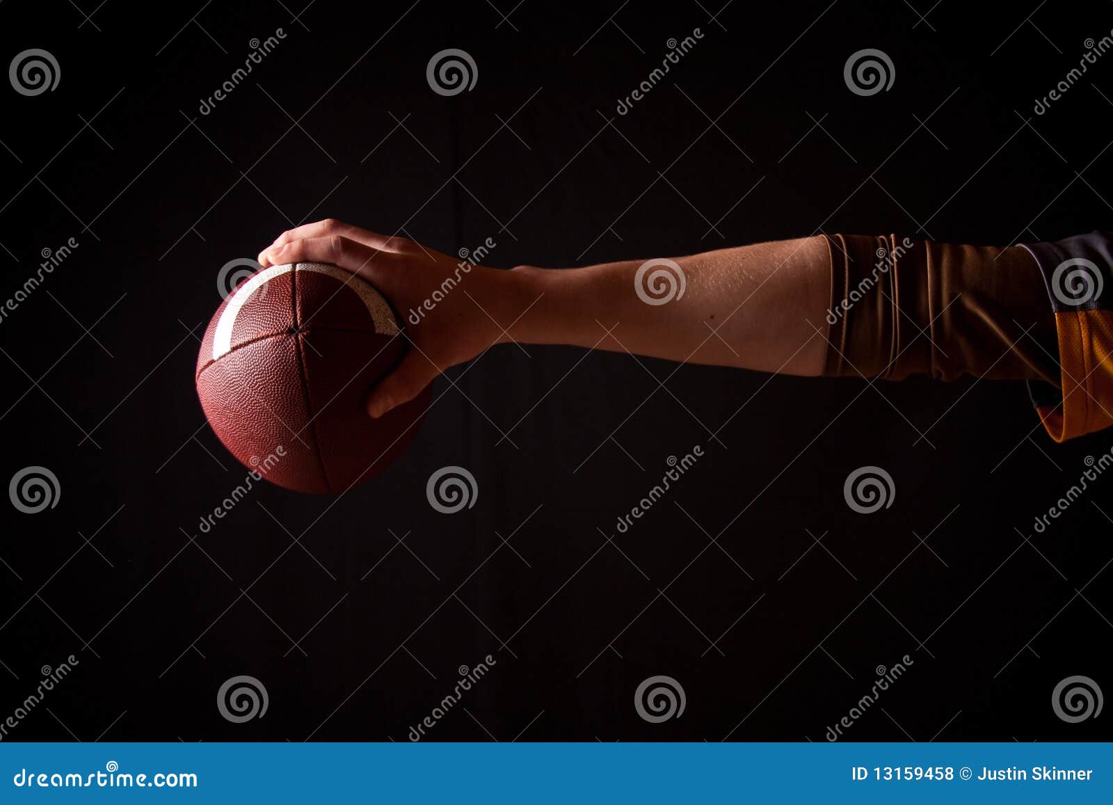 Hand Holding Football stock photo. Image of american - 13159458