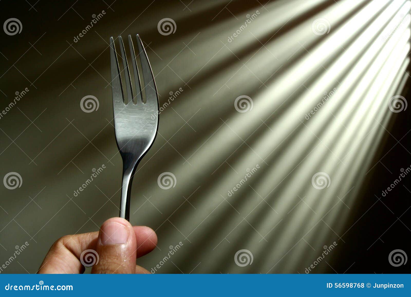 Hand holding a fork stock photo. Image of snack, holding - 56598768