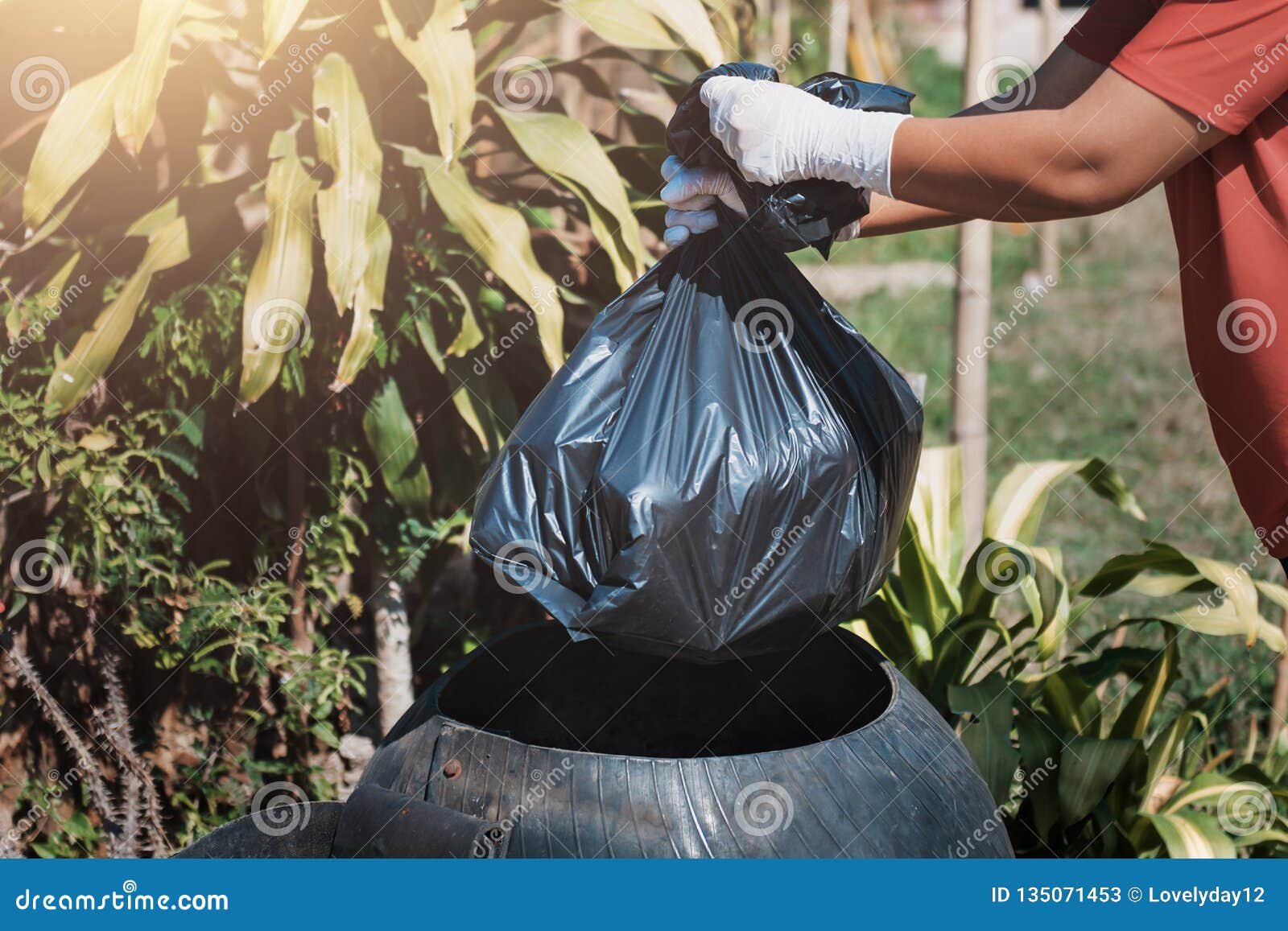 Hand Holding Garbage Bag Putting in To Trash Stock Image - Image of ...