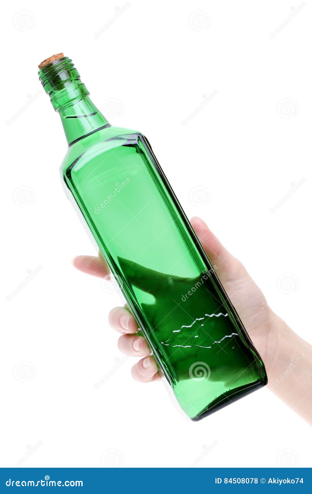 Hand holding glass bottle stock photo. Image of bottle - 84508078