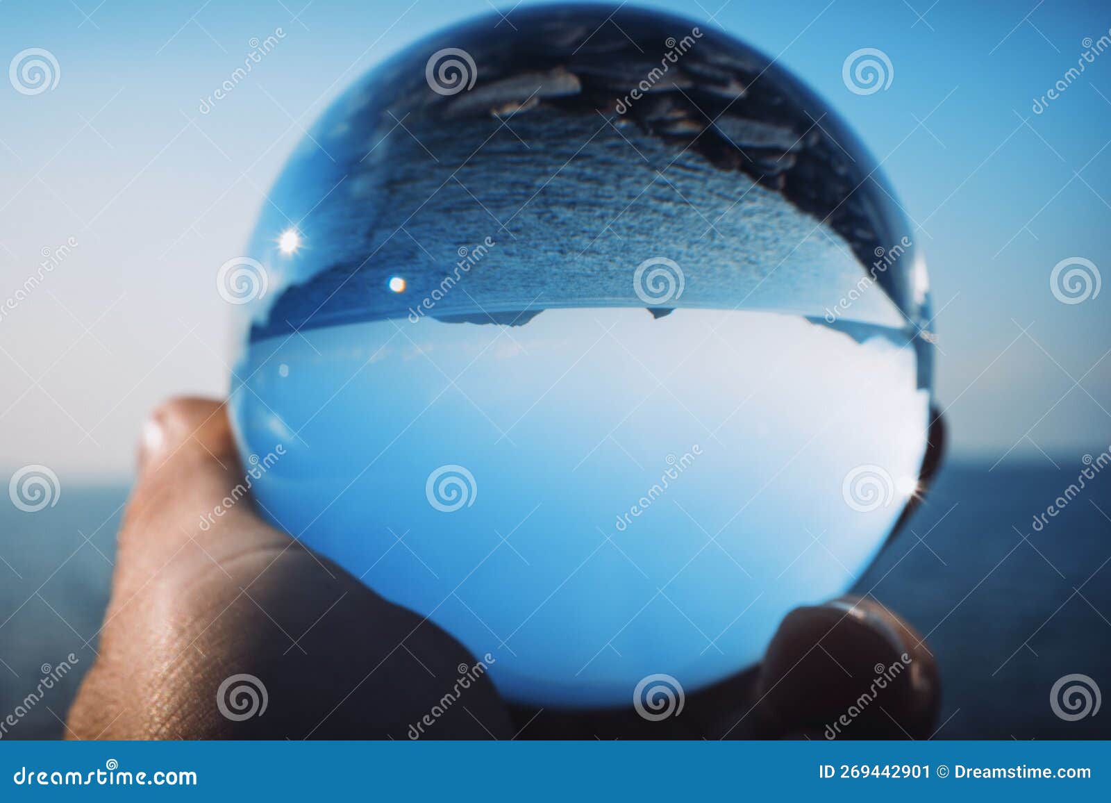 Hand Holding a Glass Reflective Wall Near an Ocean Stock Image - Image ...