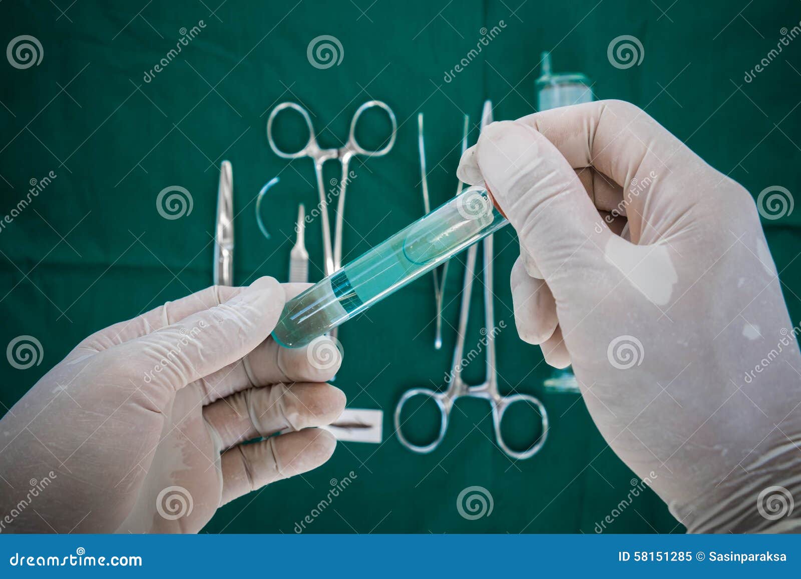 Hand Holding Glass Tube, with Instruments for Surgery Background Stock ...