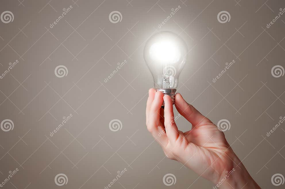 Hand with light bulb stock photo. Image of ecology, industry - 29992562