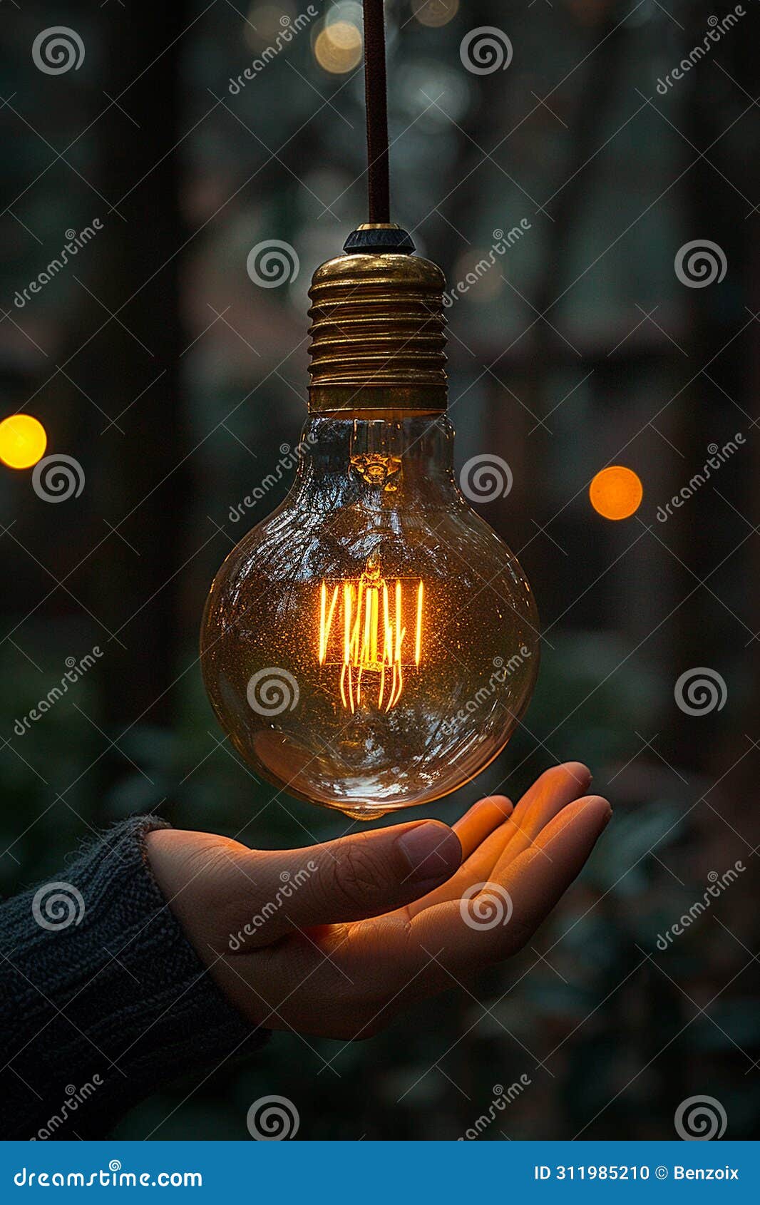 Hand Holding a Glowing Light Bulb Stock Photo - Image of power ...