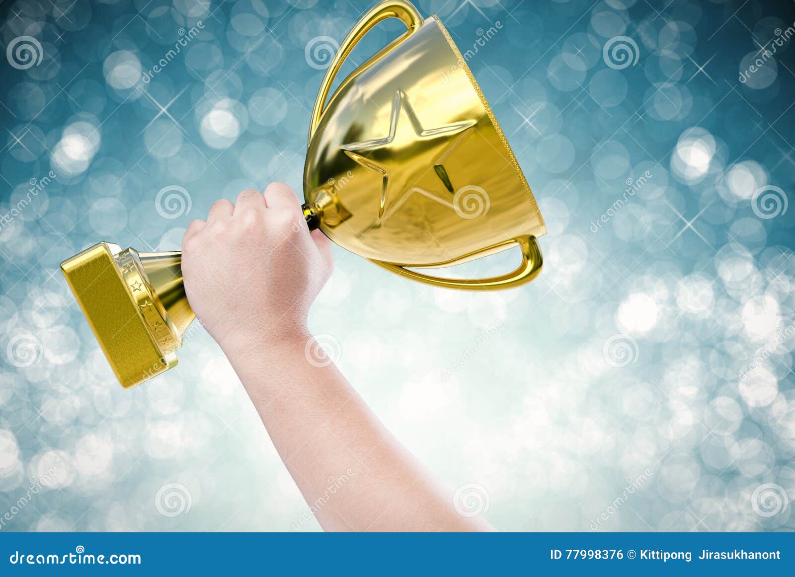 Hand holding golden trophy stock photo. Image of concept - 77998376