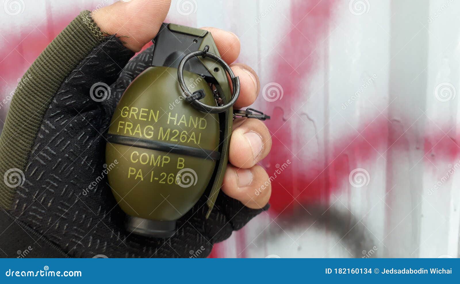 Hand holding grenade stock photo. Image of watch, gadget - 182160134