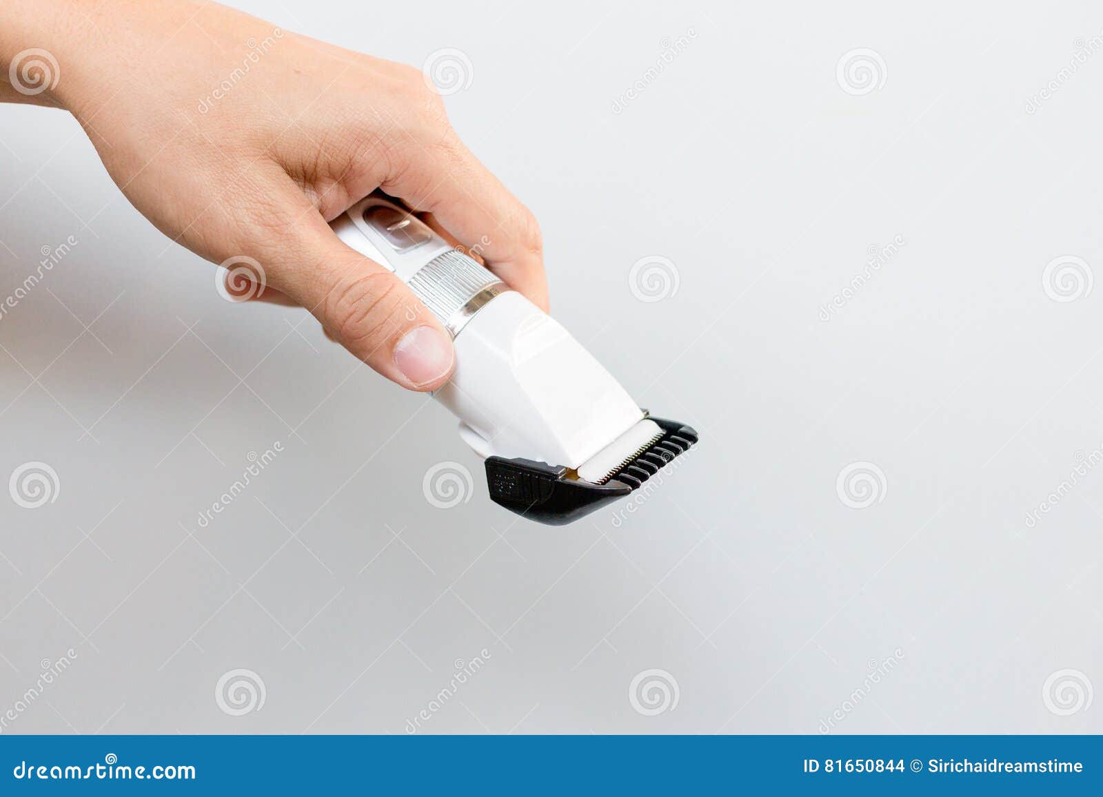 Hand holding hair clippers stock photo. Image of clippers - 81650844