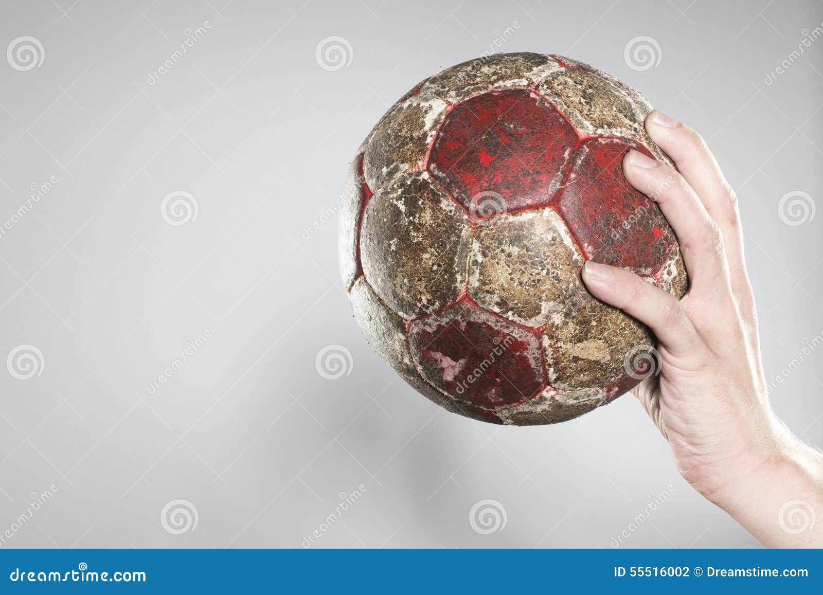 Hand holding a handball stock photo. Image of player - 55516002