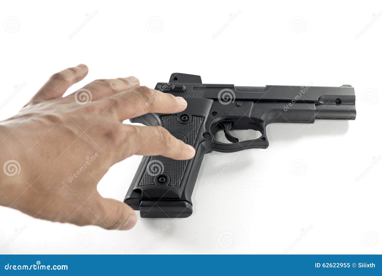 Hand holding a handgun stock image. Image of human, steel - 62622955