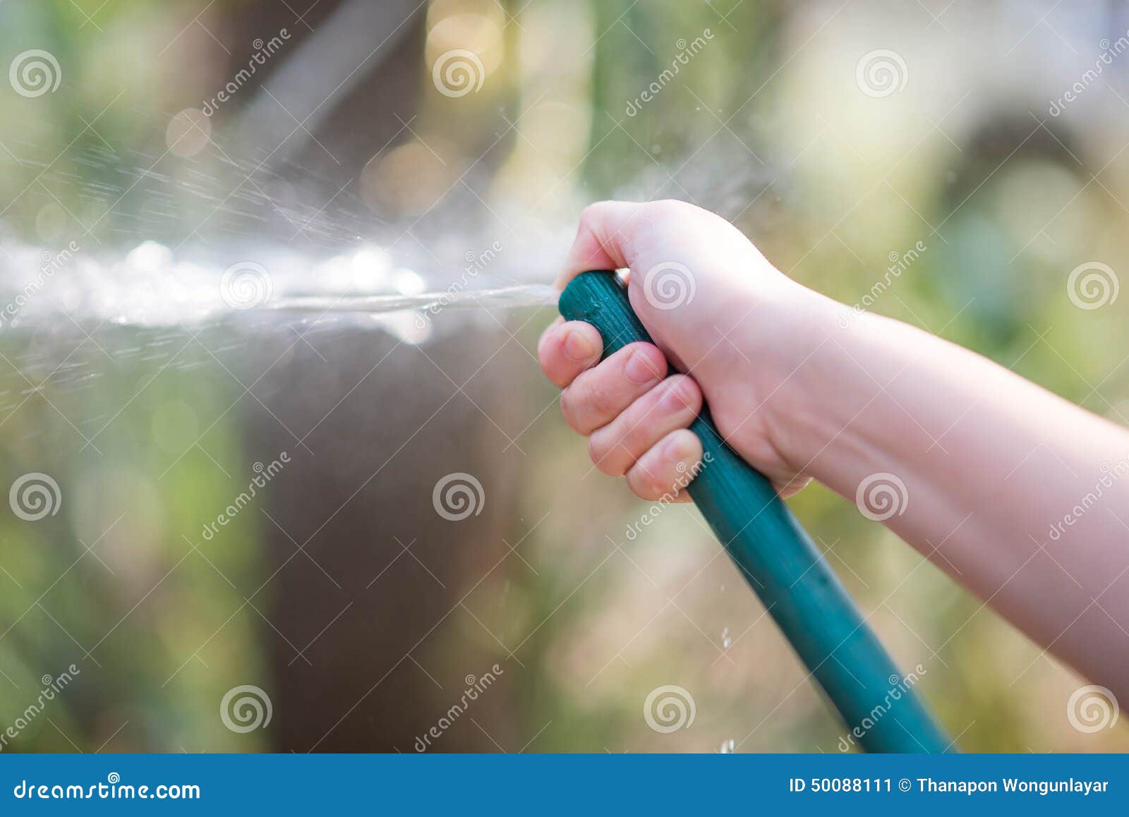 Hand holding a hose no2 stock image. Image of garden - 50088111