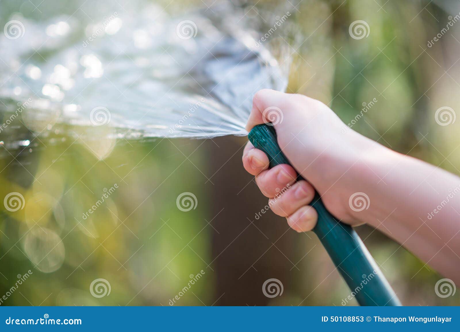 Hand holding a hose no4 stock image. Image of green, bright - 50108853